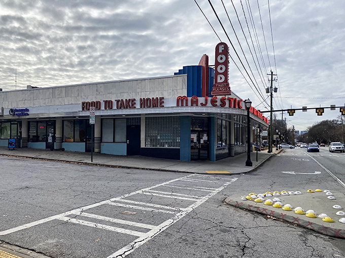 Neon dreams and waffle schemes! The Majestic Diner's iconic sign beckons like a lighthouse for the hungry, promising "Food to Take Home" and memories to cherish.