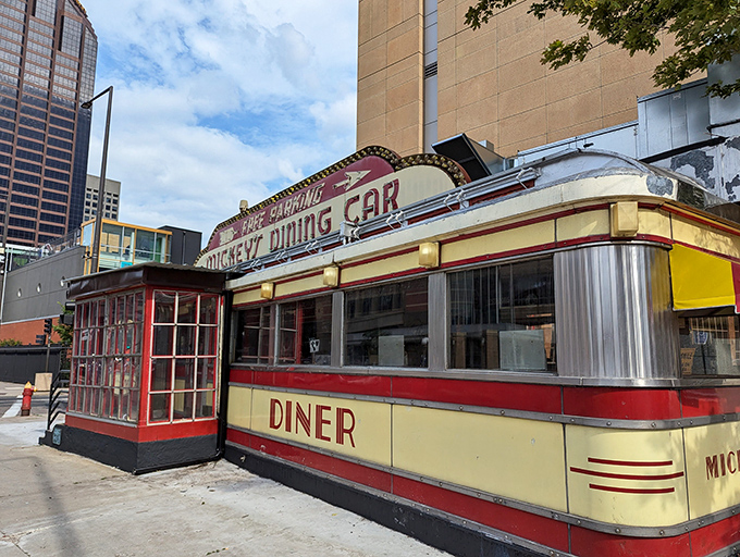 A slice of Americana on wheels! Mickey's Diner, a gleaming Art Deco treasure, stands proudly amid St. Paul's skyline, promising comfort food and nostalgia in equal measure.