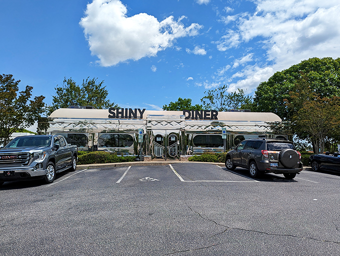 Chrome-plated dreams and waffle-scented wishes! The Shiny Diner gleams like a beacon of comfort food, beckoning hungry travelers with its retro charm.