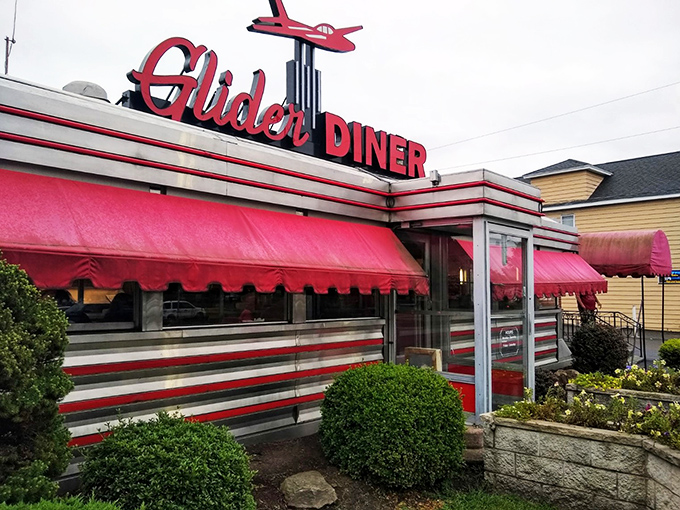 Welcome to the Glider Diner, where nostalgia meets neon! This retro gem's exterior is like a time machine with a side of fries.
