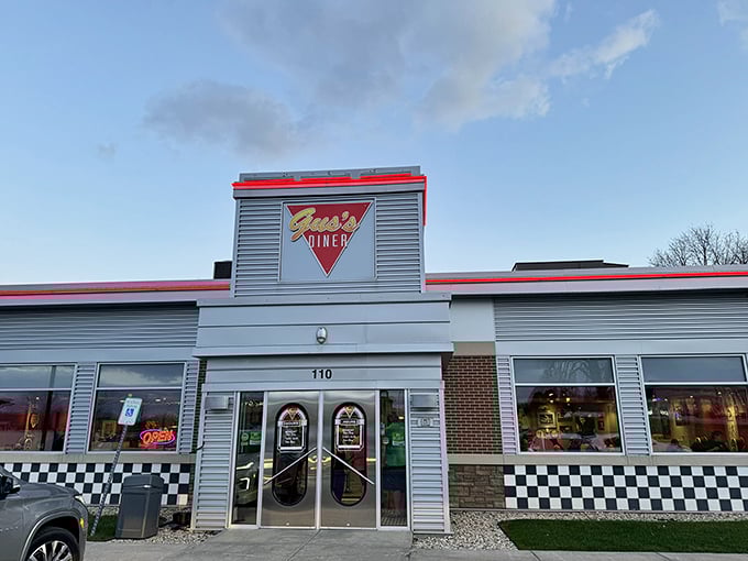 Welcome to flavor town! Gus's Diner stands proud, its red trim and checkered accents promising a feast for both eyes and stomach.