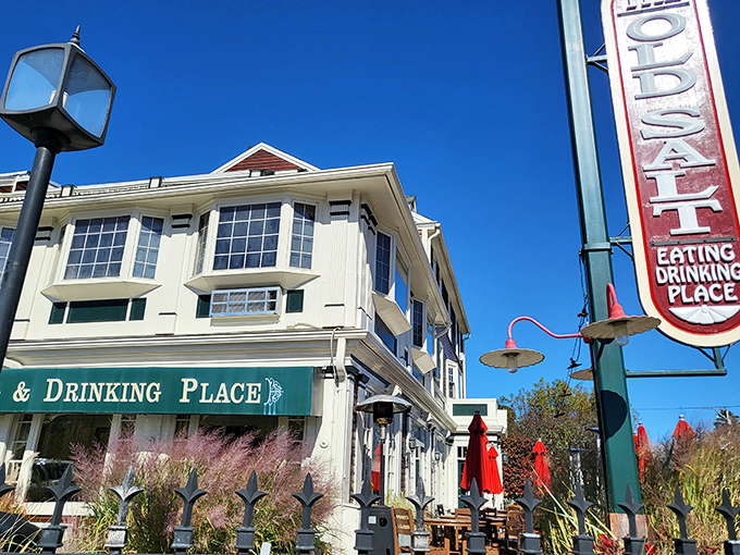 A beacon of culinary delight! The Old Salt's exterior promises a feast for the senses, with its charming New England facade and inviting red accents.