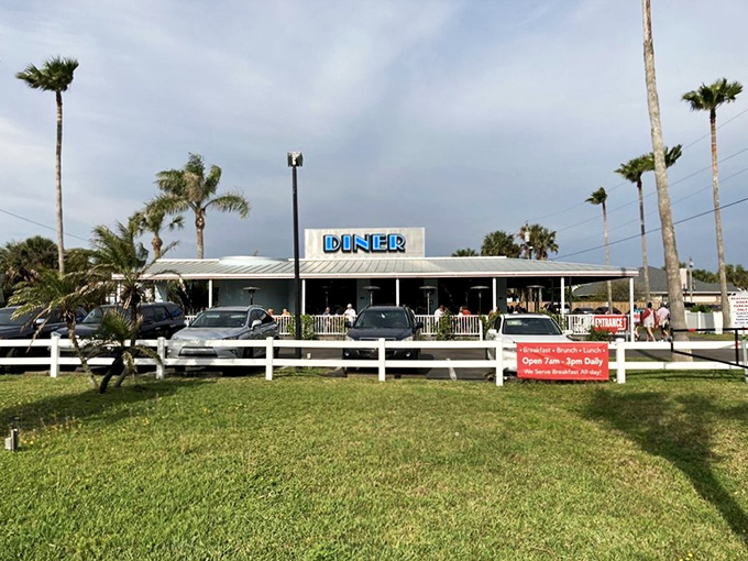 Palm trees and promise: This classic diner beckons like a mirage in the Florida sun, promising comfort food and coastal charm.
