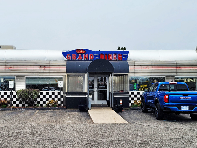The gleaming stainless steel exterior of The Grand Diner stands like a time machine to the golden age of roadside Americana. Those neon letters promise more than food&mdash;they promise nostalgia.