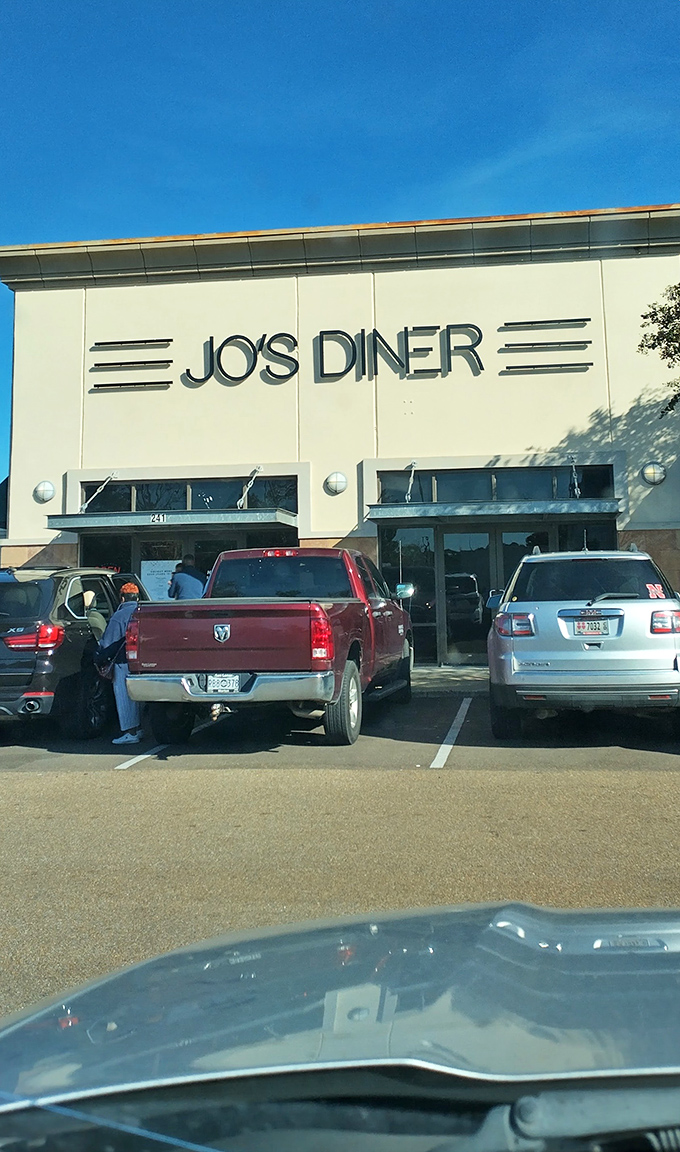 The classic facade of Jo's Diner in Flowood welcomes hungry patrons with its clean lines and retro signage&mdash;a beacon of breakfast bliss in Mississippi.