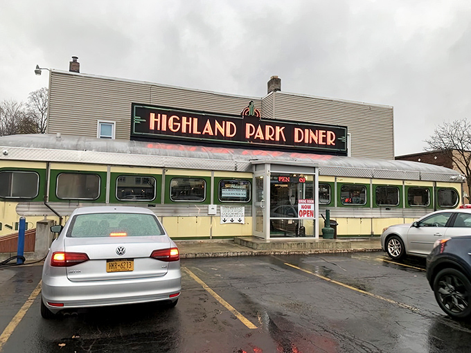 The gleaming stainless steel exterior of Highland Park Diner stands as a time capsule of Americana, beckoning hungry travelers with nostalgic charm.