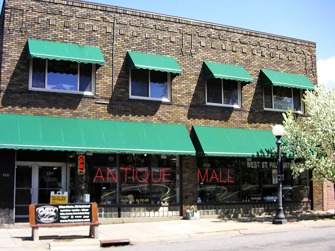 Step right up to the time machine! This brick-and-mortar portal to the past, with its inviting green awnings, promises a treasure trove of memories inside.