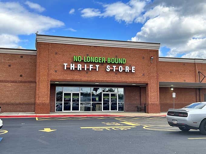 The iconic brick facade welcomes bargain hunters with its bright green signage, a beacon for treasure seekers in the North Georgia hills.