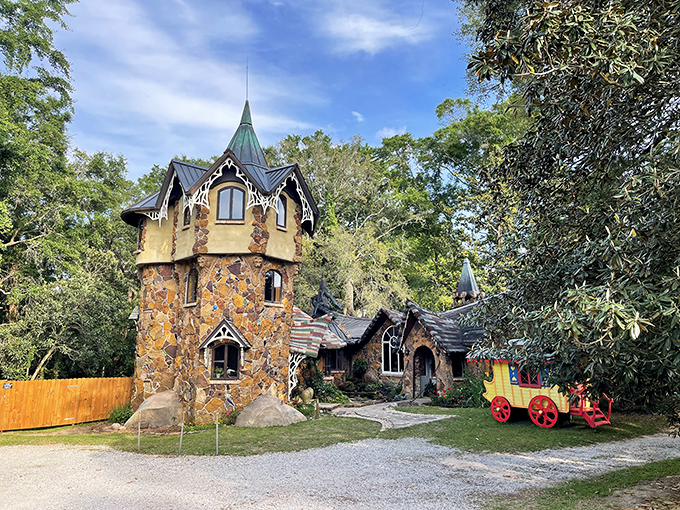 Fairy tales come to life! This whimsical stone castle, complete with a vibrant yellow wagon, looks like it was plucked straight from a storybook.