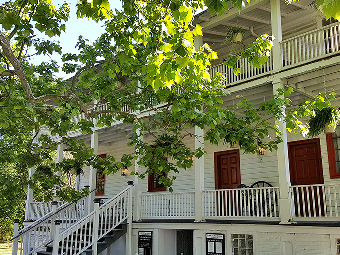 A Southern belle of a building! This charming colonial facade whispers tales of bygone eras, inviting you to step back in time for dinner.