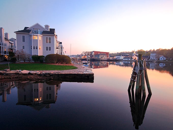 Sunset serenity in Mystic! The river reflects the sky's pastel palette, creating a scene so peaceful it could calm even the most caffeinated New Yorker. Who needs meditation apps when you have this?
