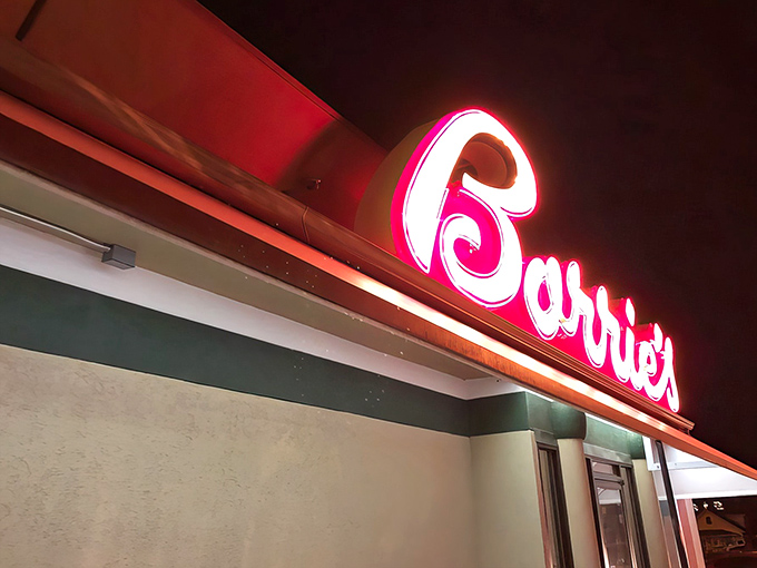 "Borrie's" in neon: a siren call for steak lovers. This sign doesn't just glow; it beckons with the promise of meaty delights.