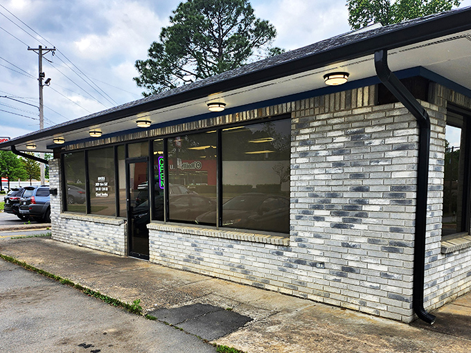 A humble brick facade hides a world of sugary delights. Mark's Do-Nut Shop: where dreams come glazed, frosted, and filled.