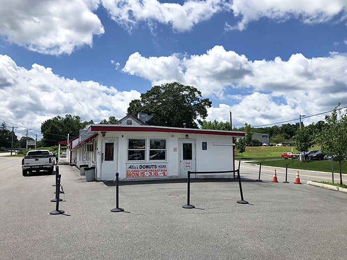A slice of Americana with sprinkles on top! Allie's Donuts stands proud, its red-trimmed exterior promising sweet delights within.