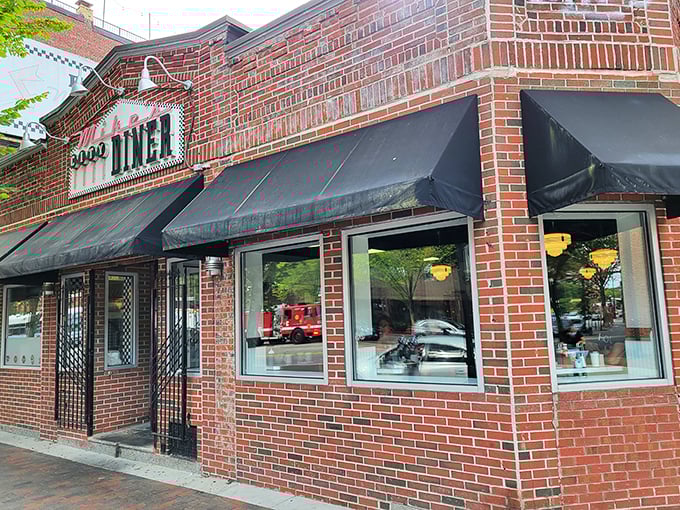 A restaurant sign that could guide hungry sailors home! Mike's City Diner stands proud, its brick facade a beacon of comfort food in Boston's South End.