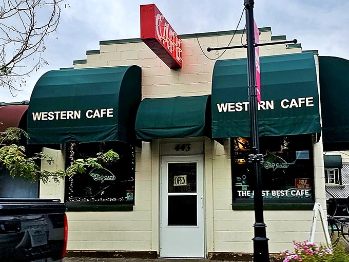 Step into a time machine disguised as a diner! The Western Café's iconic green awnings and vintage signage promise a journey back to simpler times and hearty meals.