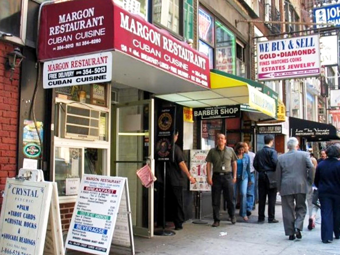 A red awning beckons like a culinary lighthouse in the urban sea. Margon's exterior promises Cuban delights just steps from the neon jungle of Times Square.