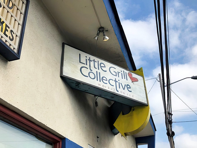 Welcome to breakfast nirvana! The Little Grill Collective's unassuming exterior hides a world of culinary delights, proving that the best things come in small, blue-striped packages.