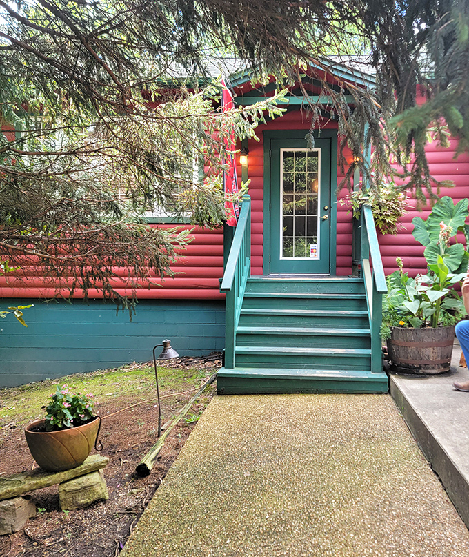 Rustic charm meets culinary delight! This log cabin's red exterior isn't just for show—it's a beacon for hungry travelers seeking a taste of the Ozarks.
