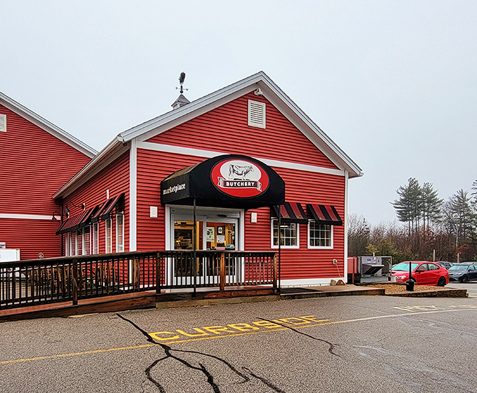 The crimson barn-like exterior of Tuckaway Tavern stands like a carnivore's lighthouse, beckoning hungry travelers with promises of protein perfection.