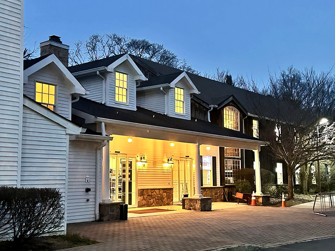 A slice of Americana served with a side of history! The Cranbury Inn stands proud, its white clapboard exterior a beacon for hungry time travelers.