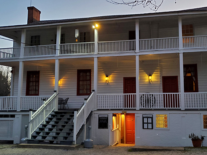 A Southern belle of a building! This charming colonial facade whispers tales of bygone eras, inviting you to step back in time for dinner.