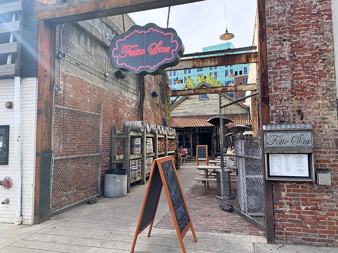 The entrance to meat paradise beckons with a glowing neon sign. This former auto body shop has found its true calling as a temple of smoke.