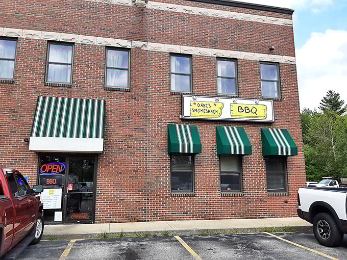 A brick facade that promises smoky delights! The Smoke Shack Cafe's exterior is like a siren song for BBQ lovers, with those green awnings beckoning you inside.