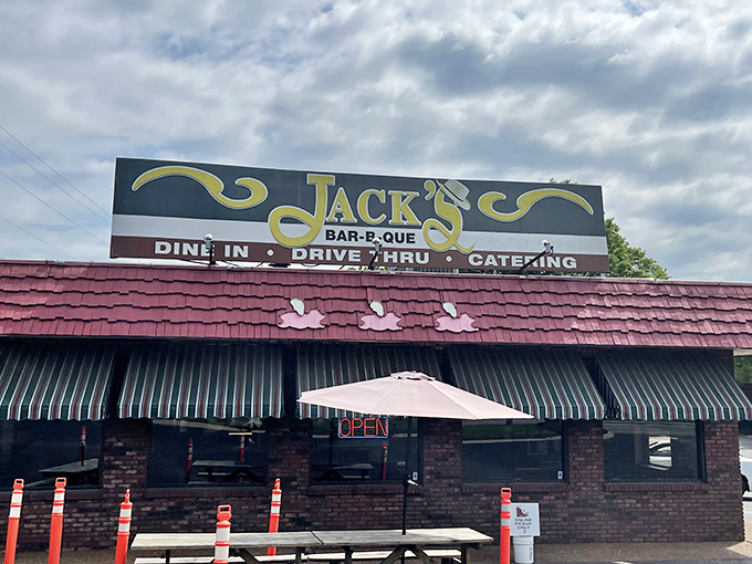 The brick-and-mortar barbecue temple beckons with its iconic sign and pink pig sentinel. Nashville's meat sanctuary awaits.