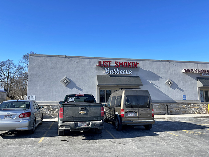 Welcome to barbecue heaven! Just Smokin' Barbecue's exterior promises a feast for the senses, with that tantalizing "BBQ RIBS" sign acting like a siren call to meat lovers everywhere.