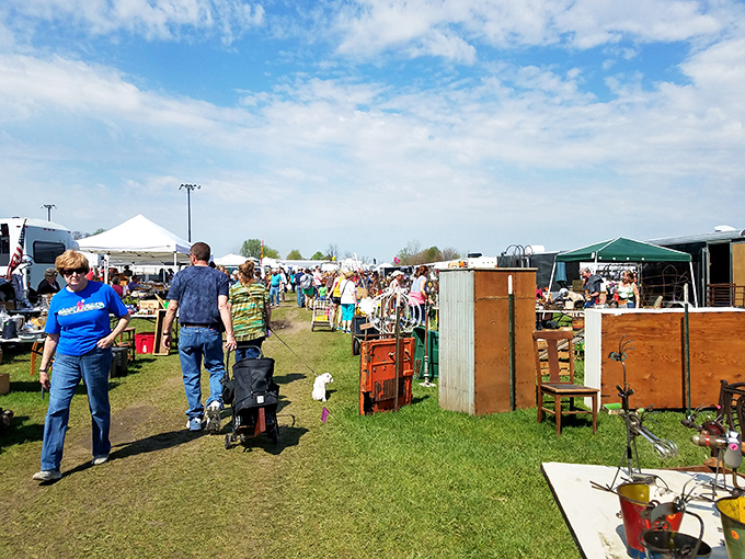 Step right up to the bargain bonanza! This sun-drenched scene at the What Cheer Flea Market promises treasures waiting to be unearthed.
