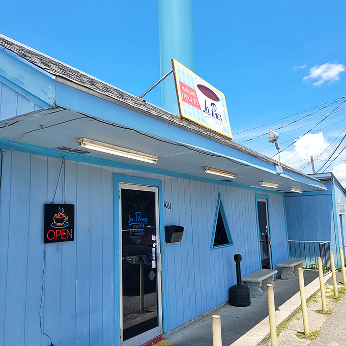 Blue skies and comfort food dreams! La Pines Cafe's exterior is like a retro postcard come to life, promising delicious adventures within.