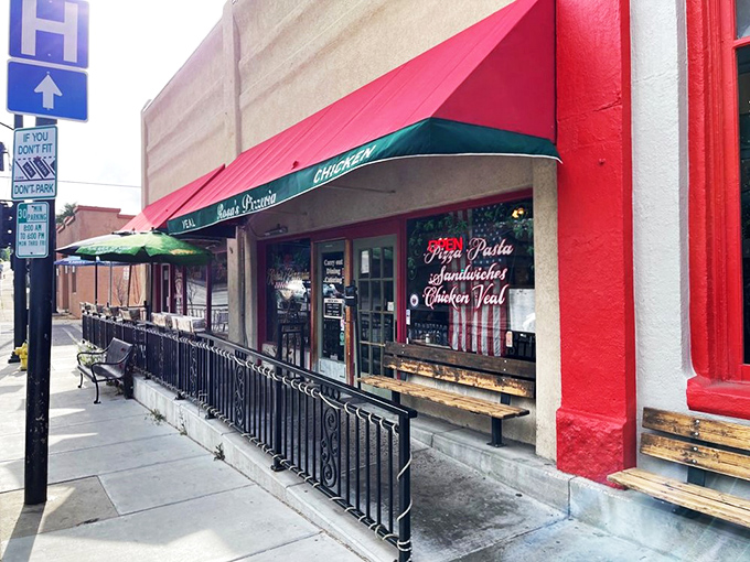 A slice of Italy on the streets of Prescott! Rosa's Pizzeria's vibrant red awning beckons like a siren song to hungry passersby.
