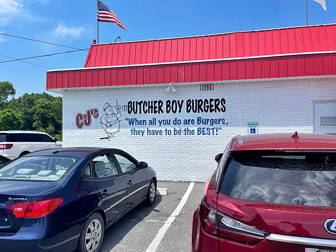 Red alert! This burger joint's exterior is so eye-catching, it's like a beacon for hungry travelers. CJ's Butcher Boy Burgers stands proud, promising meaty delights within.