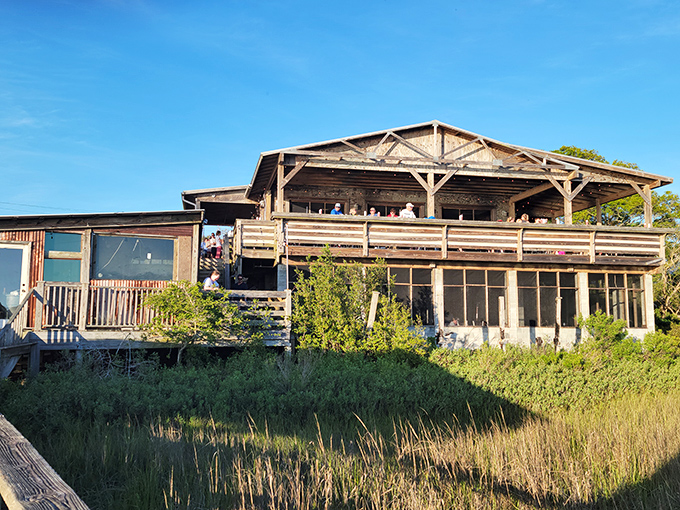 Rustic charm meets coastal bliss! This weathered wooden wonder looks like it's been telling seafood stories for decades.