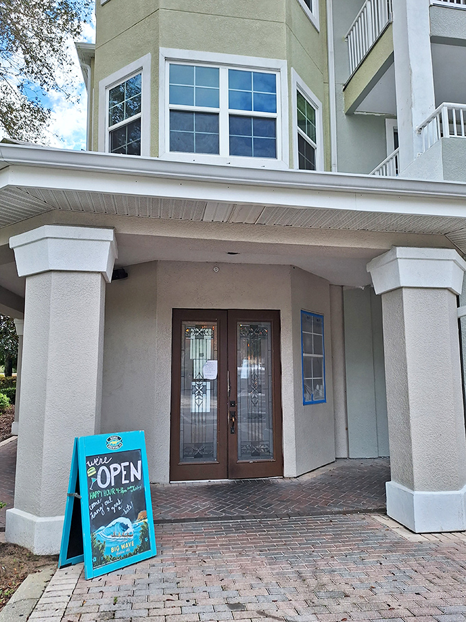 Welcome to burger paradise! Teak Neighborhood Grill's inviting facade promises a feast for the senses, with warm lighting and rustic charm that'll make you feel right at home.