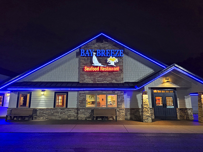 A beacon of seafood delight! Bay Breeze's neon-lit exterior promises a feast that'll have you dreaming of waves and butter sauce.