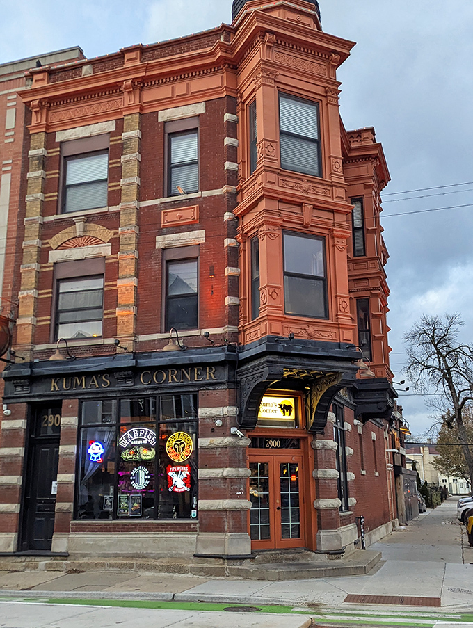 A corner of culinary rebellion! Kuma's exterior screams rock 'n' roll, with its brick facade and neon signs promising a headbanging burger experience.