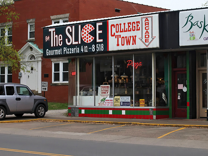 Welcome to pizza paradise! This retro-chic storefront is like a time machine that transports you straight to flavor town.