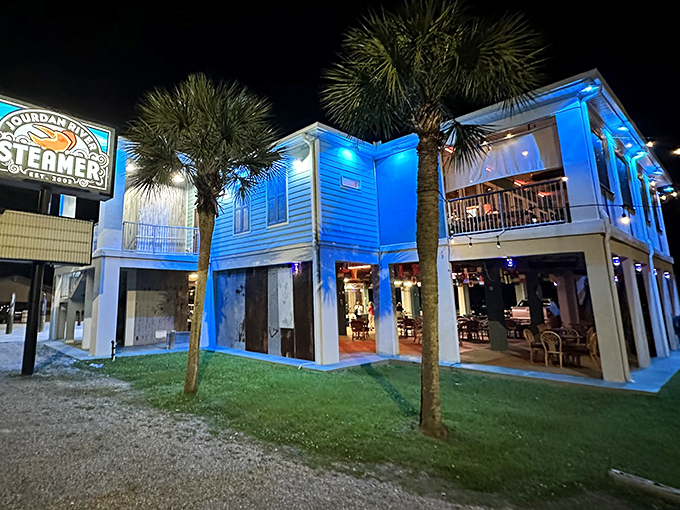 Seafood paradise found! This teal-hued haven on stilts is where lobster dreams and crab cravings come to life.