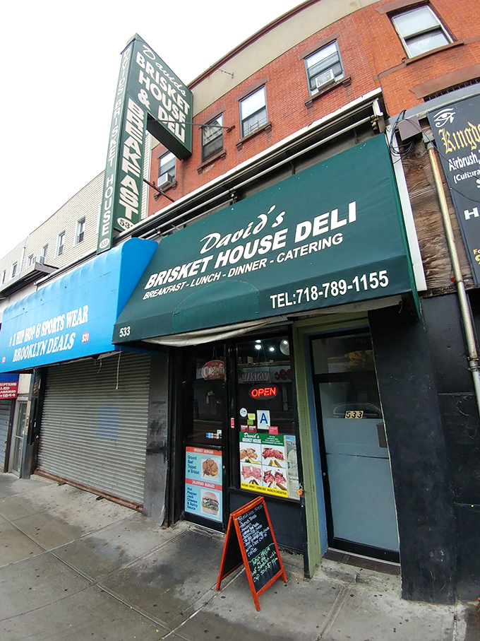 A beacon of brisket brilliance! David's Brisket House stands proud, its green awning a siren call to sandwich lovers everywhere.