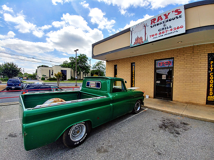 Welcome to burger paradise! This unassuming exterior hides a world of flavor, with that vintage green truck hinting at the old-school goodness waiting inside.