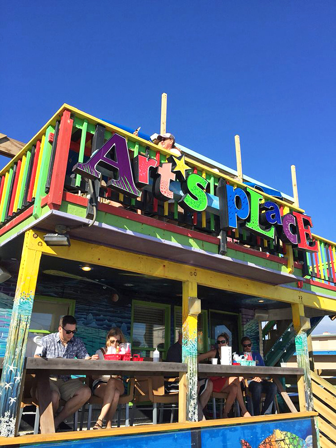 Welcome to Art's Place, where the exterior is as colorful as the characters inside. This beachside shack screams "fun" louder than a seagull eyeing your fries.