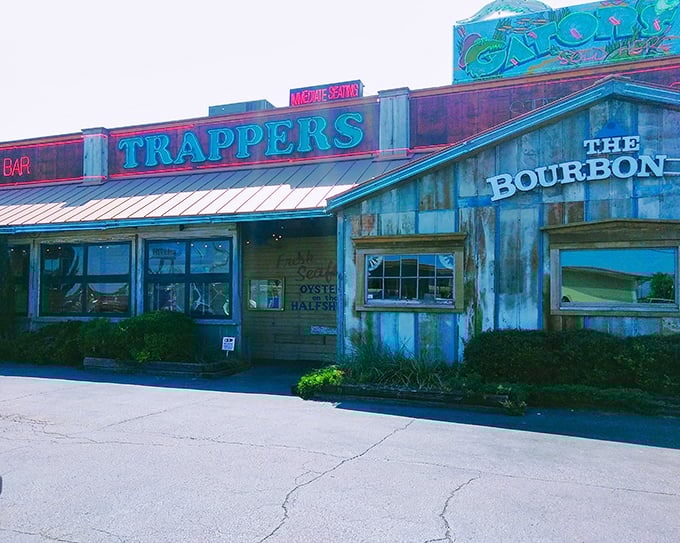 Trapper's by night: Where neon dreams and seafood wishes come true. This rustic exterior promises a feast for both eyes and stomach!