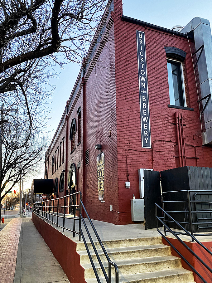 The iconic red brick exterior of Bricktown Brewery welcomes visitors. History and hops unite under one distinctive awning.