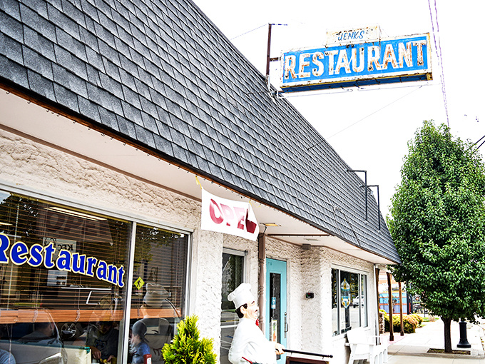 A slice of small-town Americana! Jenks Restaurant's weathered sign stands proud, like a beacon calling all breakfast lovers home.