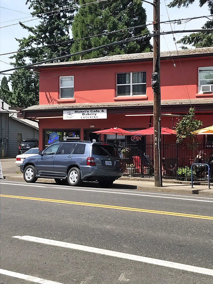 Welcome to flavor town! Mehri's Cafe & Bakery's cherry-red exterior is like a beacon for hungry souls in Portland.