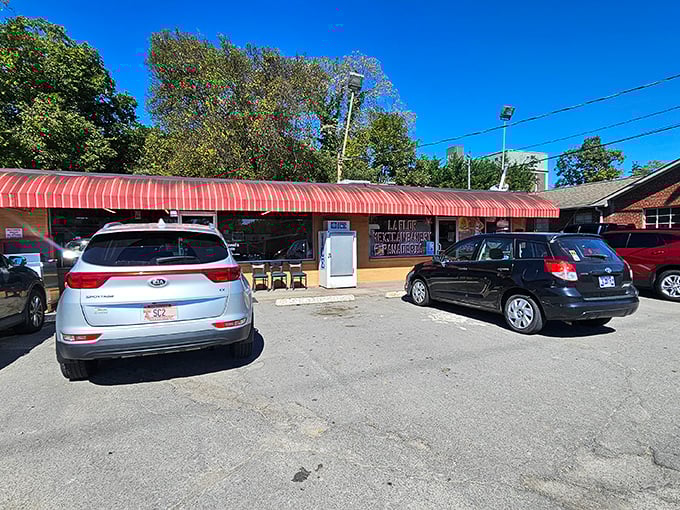 Welcome to Colonel's Cafe, where the red-striped awning beckons like a breakfast beacon. This unassuming exterior hides a world of culinary delights!
