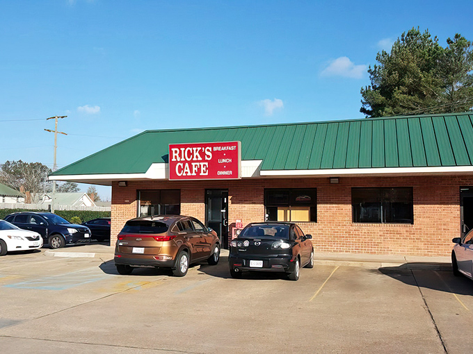 Welcome to Rick's Cafe, where the green roof and red sign beckon like a lighthouse for hungry souls. This unassuming exterior hides a treasure trove of comfort food delights!