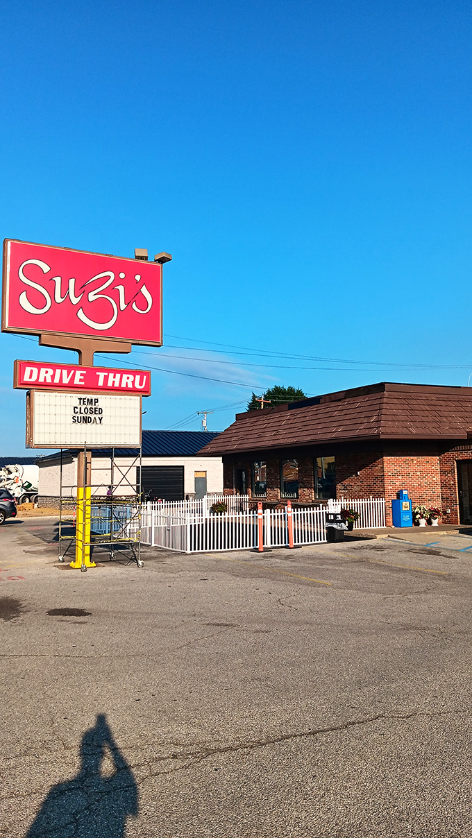 A beacon of comfort food hope! Suzi's red sign shines like a lighthouse, guiding hungry souls to a harbor of heavenly biscuits and gravy.